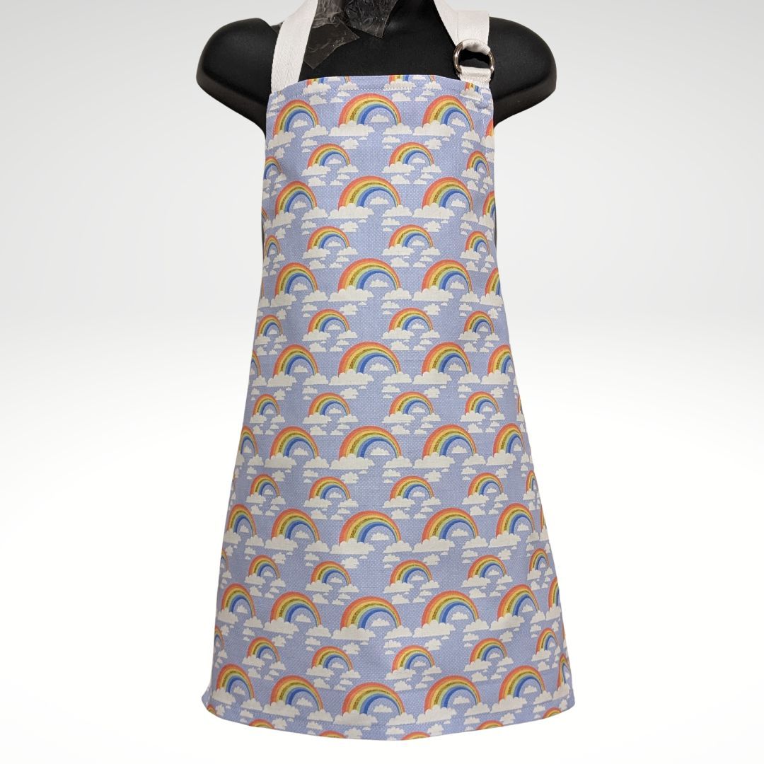 Rainbows on blue child's apron – Handmade by Brambleberry